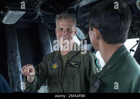 U.S. Marine Corps Col. Derek Brannon, commanding officer of Marine Aircraft Group 12, left ...