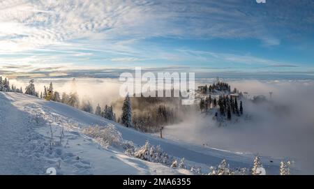 Landscape from top of Postavaru mountain with ski slopes and cable car ...