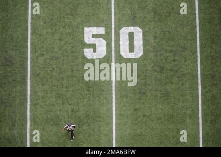 Football near the 50 yard line Stock Photo - Alamy