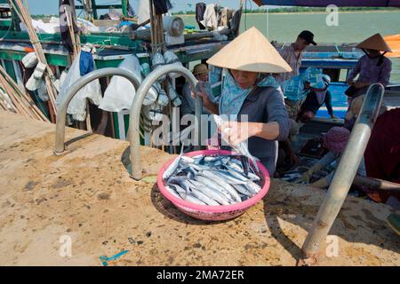 Small fishing pier on the Thu Bon River where a fishing boat is ...