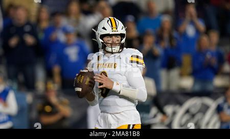 Wyoming quarterback Andrew Peasley (6) throws downfield during the ...