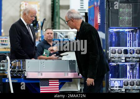 President Joe Biden looks at the IBM System One quantum computer during ...