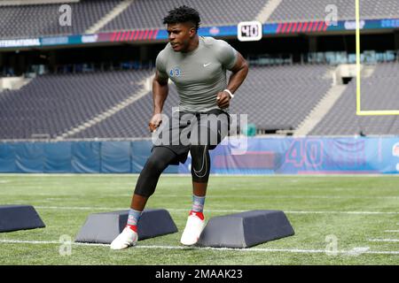 Defensive lineman Kenneth Odumegwu, of Nigeria, participates in a drill ...