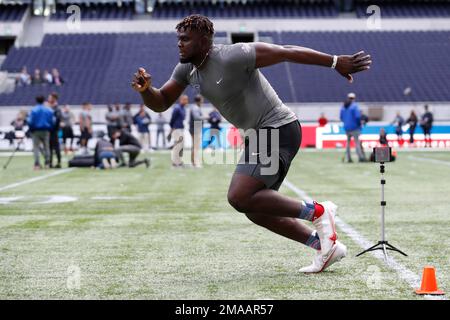 Offensive lineman Basil Chijioke Okoye, of Nigeria, runs the 40-yard ...
