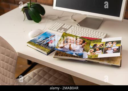 on table open photobook from photo shoot of family. preservation of ...
