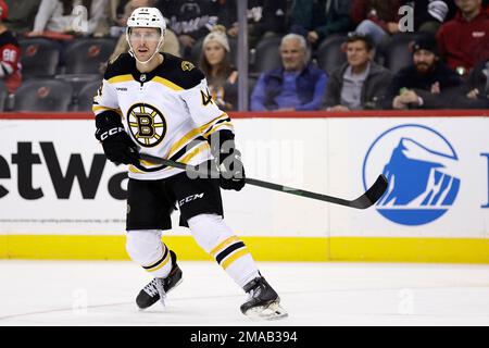 Boston Bruins defenseman Dan Renouf (44) skates past New Jersey Devils ...