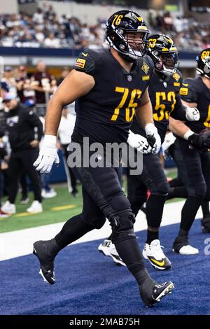 Washington Commanders offensive tackle Sam Cosmi (76) blocks during an ...
