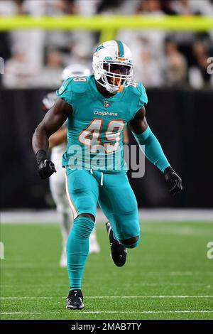 Miami Dolphins linebacker Sam Eguavoen (49) gets ready for play to ...