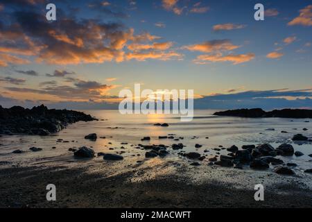 Dramatic coastal sunset at Rhosniegr on Anglesey, North Wales Stock ...