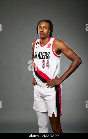 Portland Trail Blazers forward Jabari Walker (34) reacts after falling ...