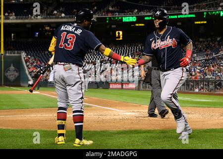 Atlanta Braves' Orlando Arcia, right, celebrates his solo home run with ...
