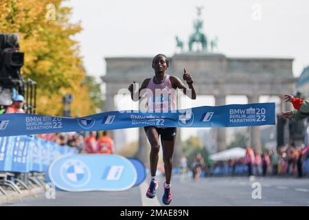 Ethiopia's Tigist Assefa celebrates as she crosses the finish line to ...