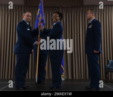 Col. James Gherdovich, 319th Mission Support Group commander, receives ...