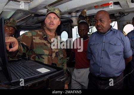Onboard the bridge of the US Navy (USN) Aircraft Carrier, USS KITTY HAWK (CV 63), Quartermaster ...