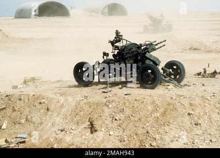 A Soviet-made ZPU-4 14.5mm anti-aircraft gun stands abandoned at Al ...