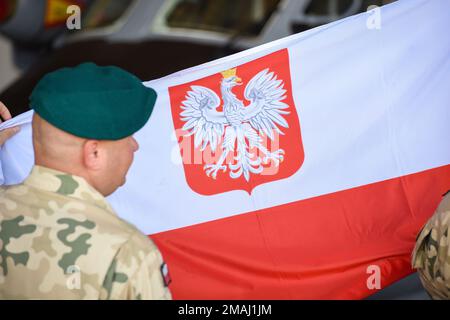 Polish Navy Cmdr. Sebastian Rak (right), outgoing commander of the ...