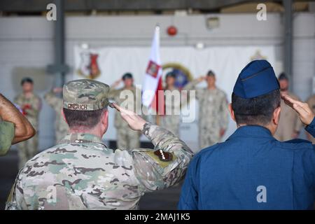 Polish Navy Cmdr. Sebastian Rak (right), outgoing commander of the ...