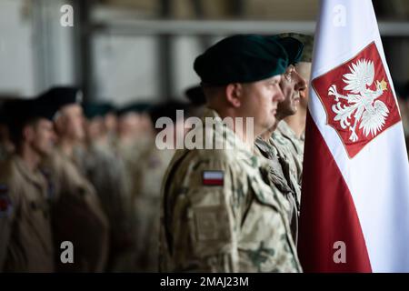 Polish Navy Cmdr. Sebastian Rak (right), outgoing commander of the ...