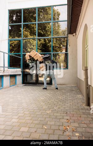 Reckless delivery worker dropping pizza boxes, scared courier running ...