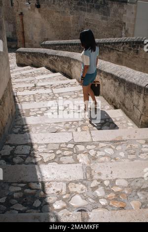 People enjoying daily life and sights in the Italian town of Matera ...