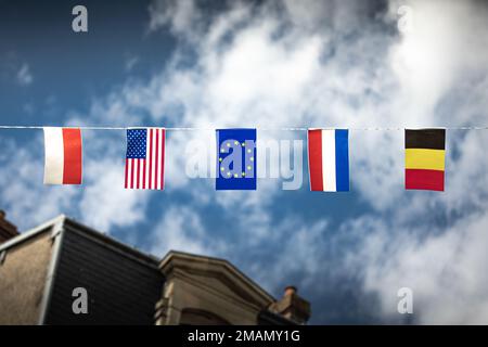 Flags adorn the streets of Carentan for the D-Day celebrations in ...