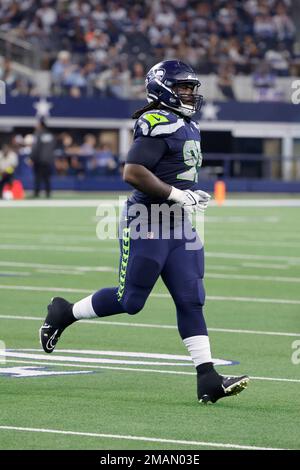 Seattle Seahawks defensive tackle Myles Adams (95) jogs off th field ...