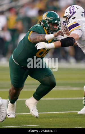 Baylor defensive lineman Siaki Ika runs a drill at the NFL football ...
