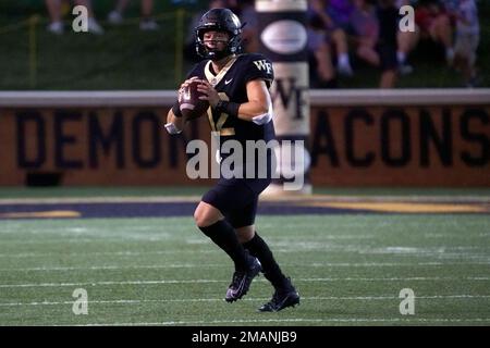 Wake Forest quarterback Mitch Griffis (12) scrambles against VMI during ...