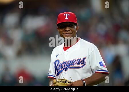 Texas Rangers interim manager Tony Beasley, left, greets first base ...
