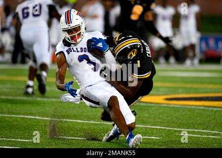 Louisiana Tech wide receiver Tre Harris runs with the ball as Missouri defensive back Jaylon ...