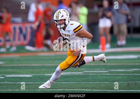 Wyoming quarterback Andrew Peasley carries the ball during an NCAA ...