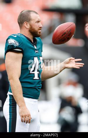 Philadelphia Eagles long snapper Rick Lovato (45) spins a football on ...