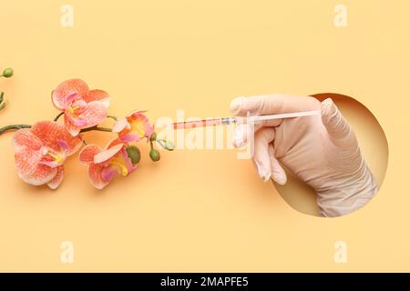 Female doctor with syringe and flowers on beige background Stock Photo ...