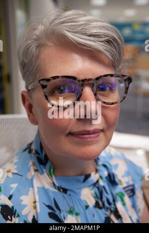 Holly Keene-Steele, a library technician, searches for a specific book ...