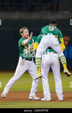 Oakland Athletics' Nick Allen, left, douses Jonah Bride with iced water ...