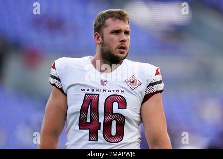 Washington Commanders tight end Jake Hausmann runs on the field in the ...