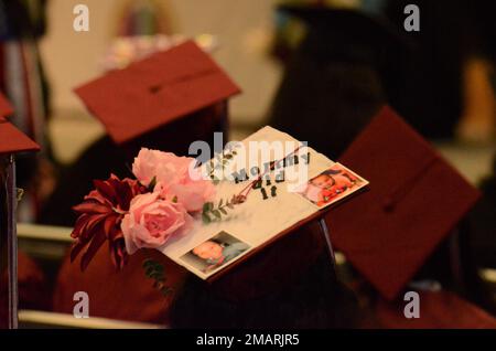 A special decorated graduation cap reading “My destiny was delayed, but ...