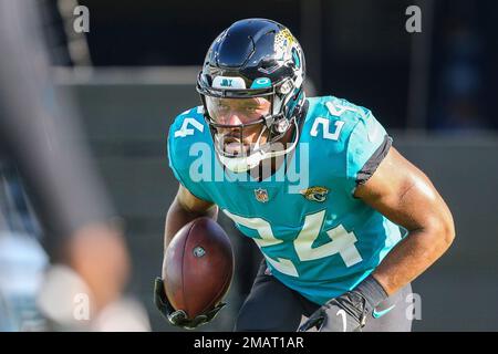 Jacksonville Jaguars running back Snoop Conner, left, runs during a ...