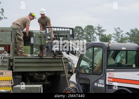 Members of the 239th Combat Communications Squadron set up a temporary ...
