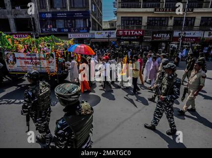 Soldiers keep vigil as Kashmiri Hindus take part in a procession to ...