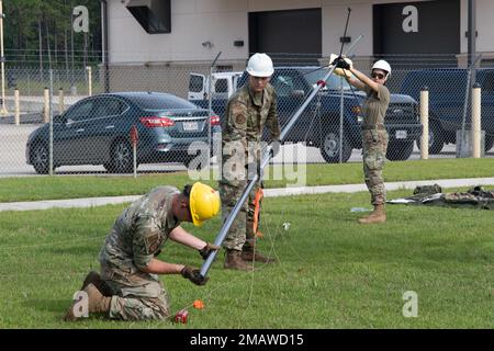 Members of the 239th Combat Communications Squadron ready a satellite ...