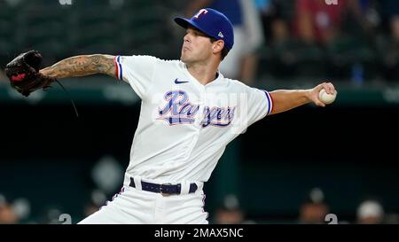 Texas Rangers pitcher Cole Ragans signals to the catcher during the ...