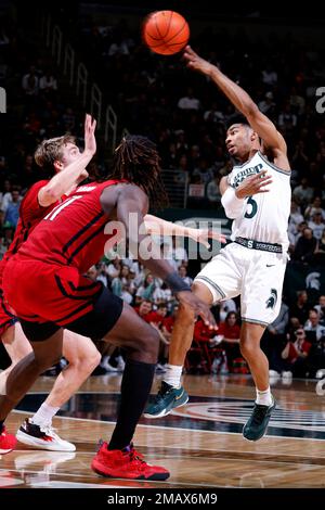 Michigan State's Jaden Akins, right, shoots against Michigan's Jett ...