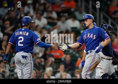 Texas Rangers' Corey Seager, right, hits a home run during the fifth ...