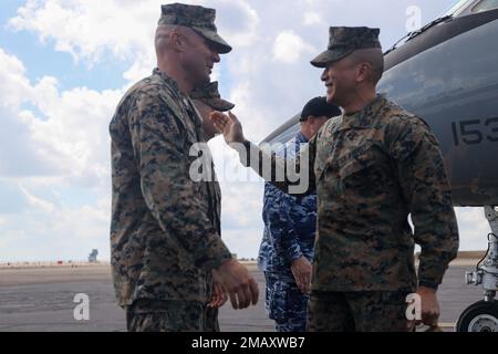 Sgt. Maj. Peter A. Siaw, right, accepts the non-commissioned officer’s ...