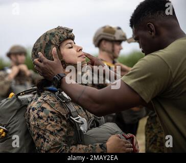 U.S. Marine Corps parachute riggers conduct air delivery operations ...