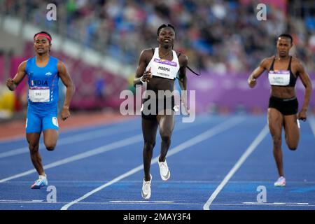 Christine Mboma, of Namibia, crosses the finish line in her heat of the ...
