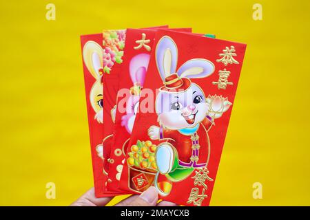 Theme red envelopes with rabbit, Chinese blessing words on yellow ...