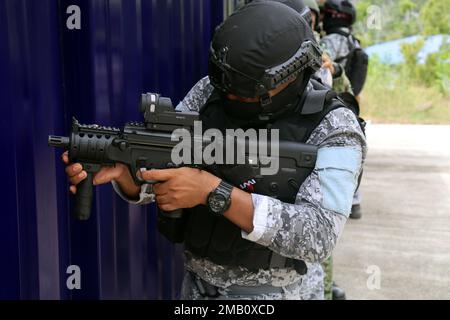 A member of the Philippine Coast Guard Special Operations Force and his ...