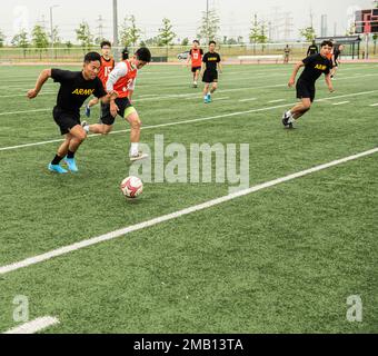 Combined teams of KATUSA and U.S. Soldiers participate in a 4x4 relay ...
